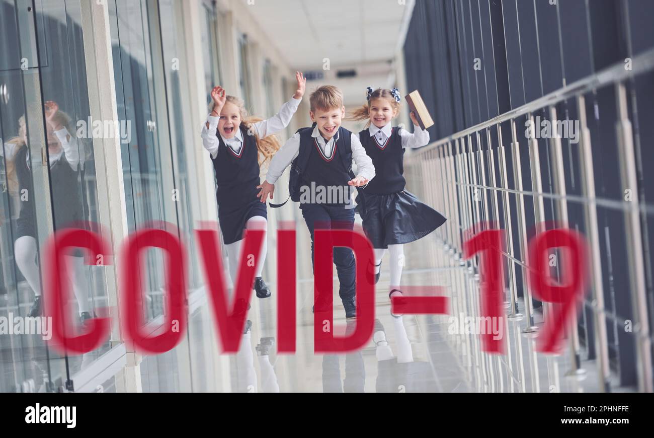 Red quarantine word. Group of kids in school uniform running together ...