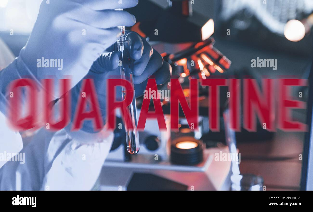 Red quarantine word. Scientist in protective uniform working with virus ...