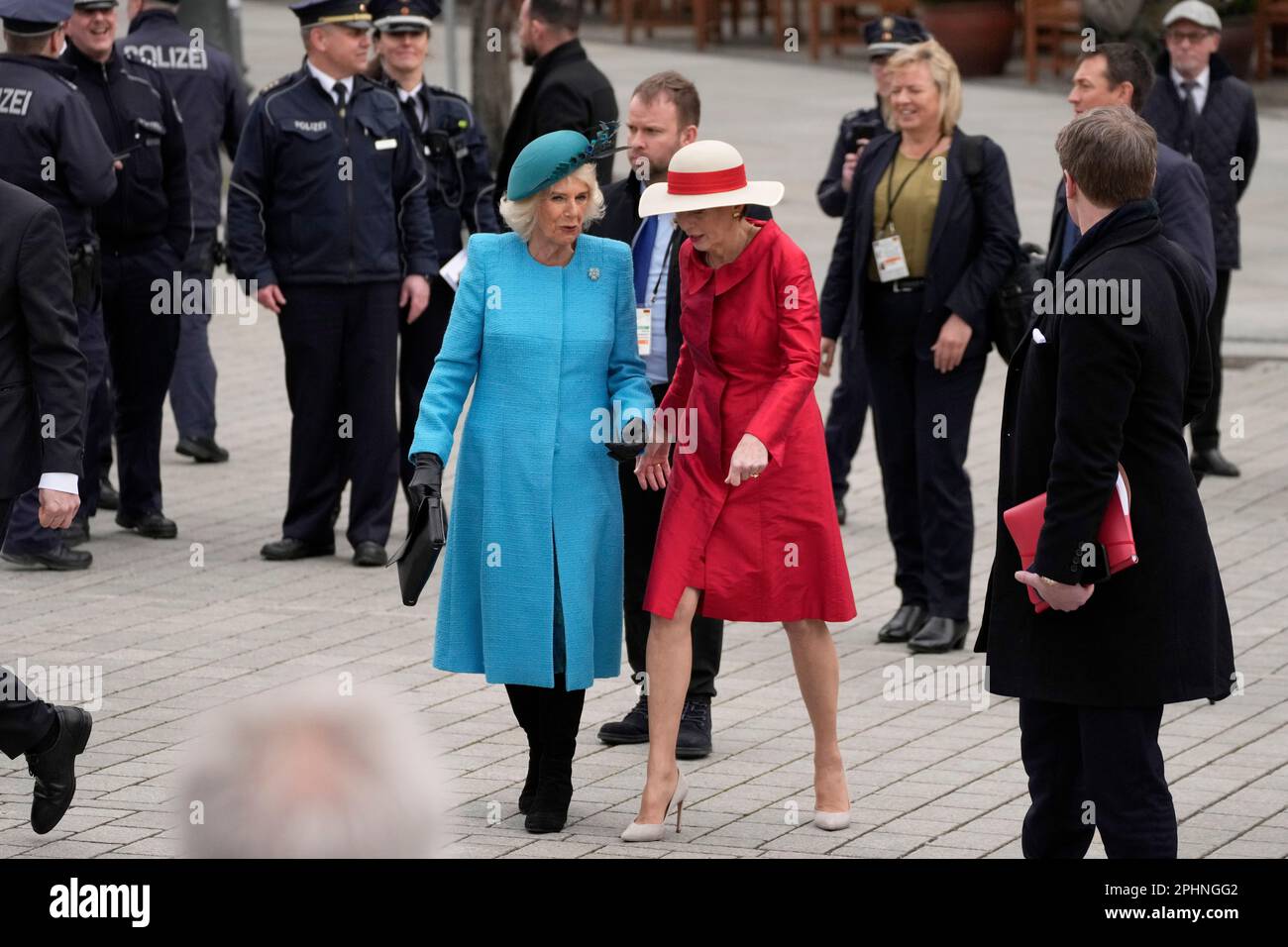 Britain's Queen Consort Camilla, center left, walks with Elke ...