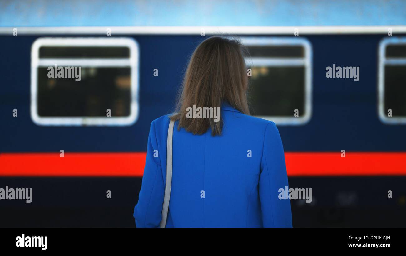 Woman looks train departure hi-res stock photography and images - Alamy