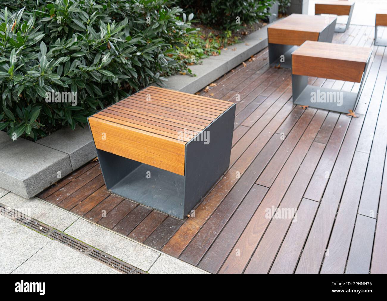 New modern bench in park. Outdoor city architecture, wooden benches ...
