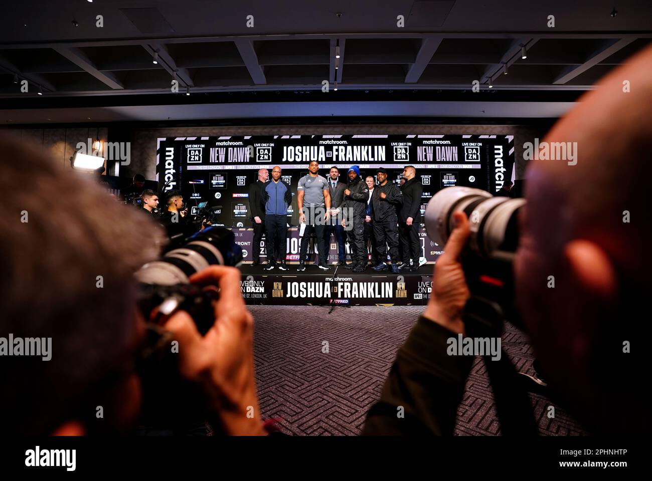 Boxing promoter Eddie Hearn stands in the centre of Anthony Joshua and ...