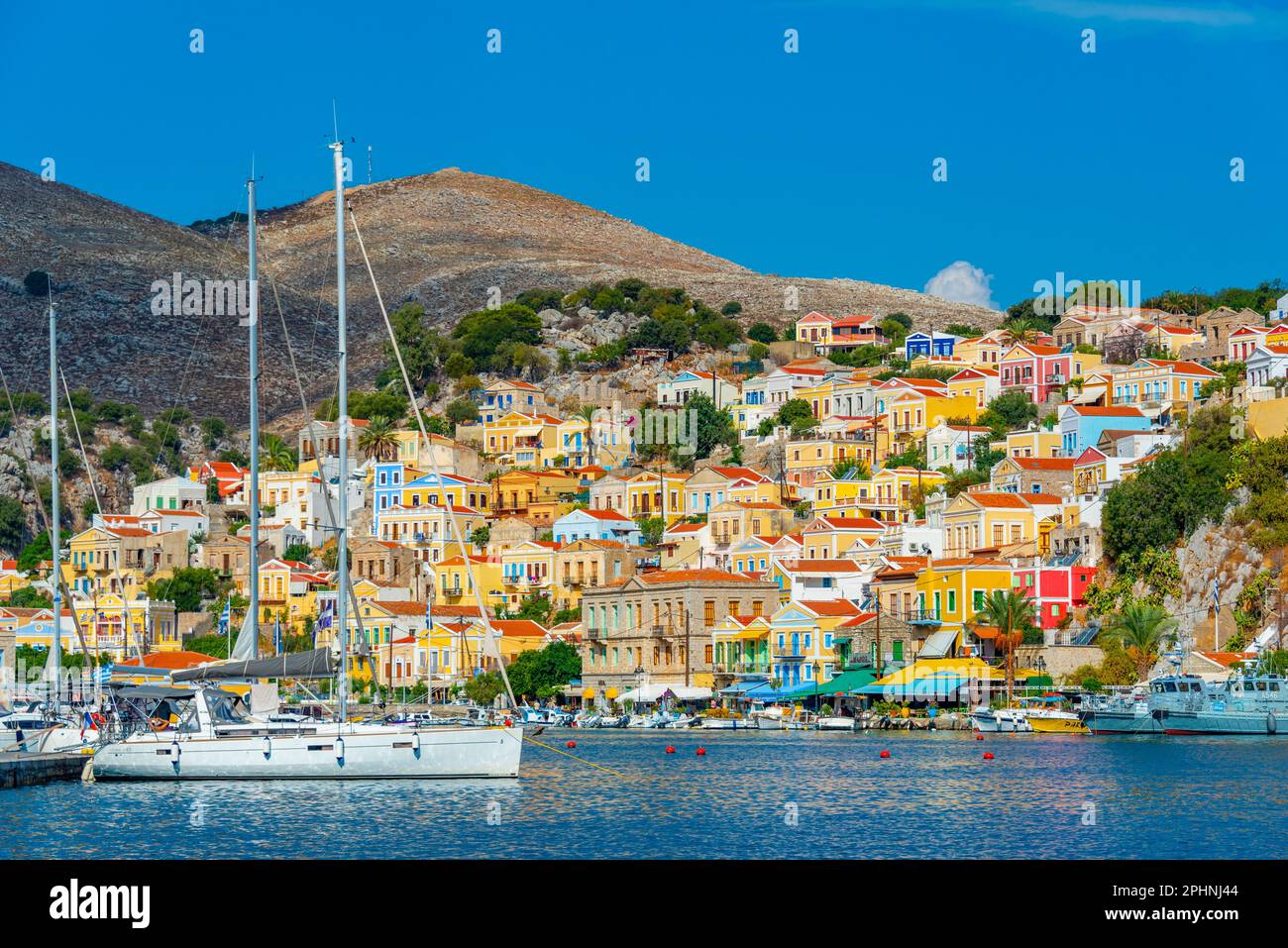 Colourful houses at waterfront of Greek island Symi Stock Photo - Alamy