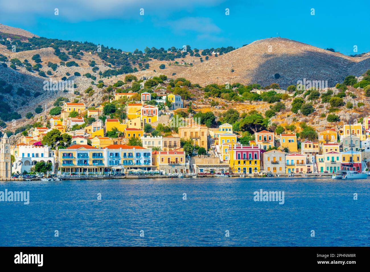 Colourful houses at waterfront of Greek island Symi Stock Photo - Alamy