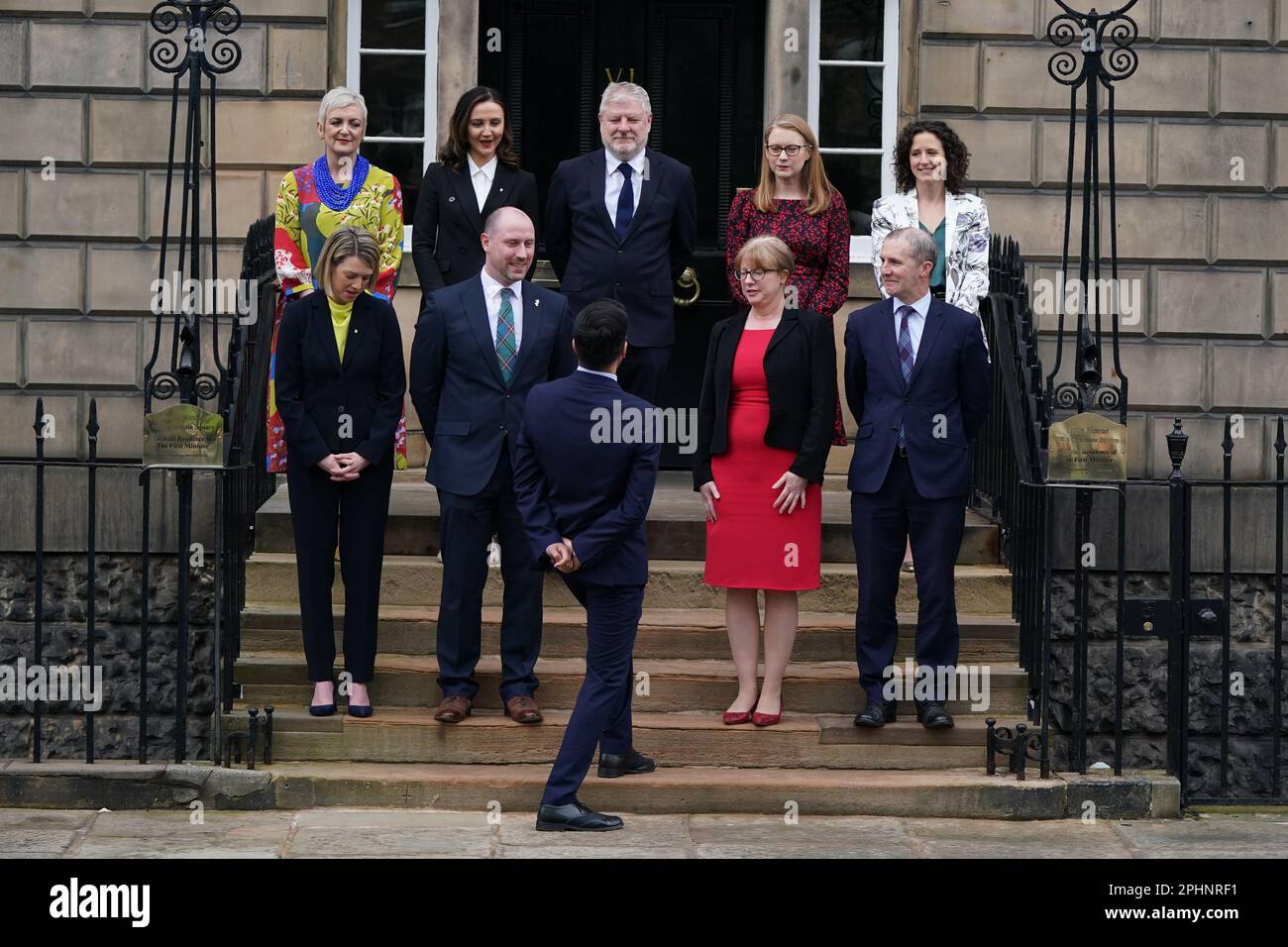 Newly elected First Minister of Scotland Humza Yousaf (centre) with his ...