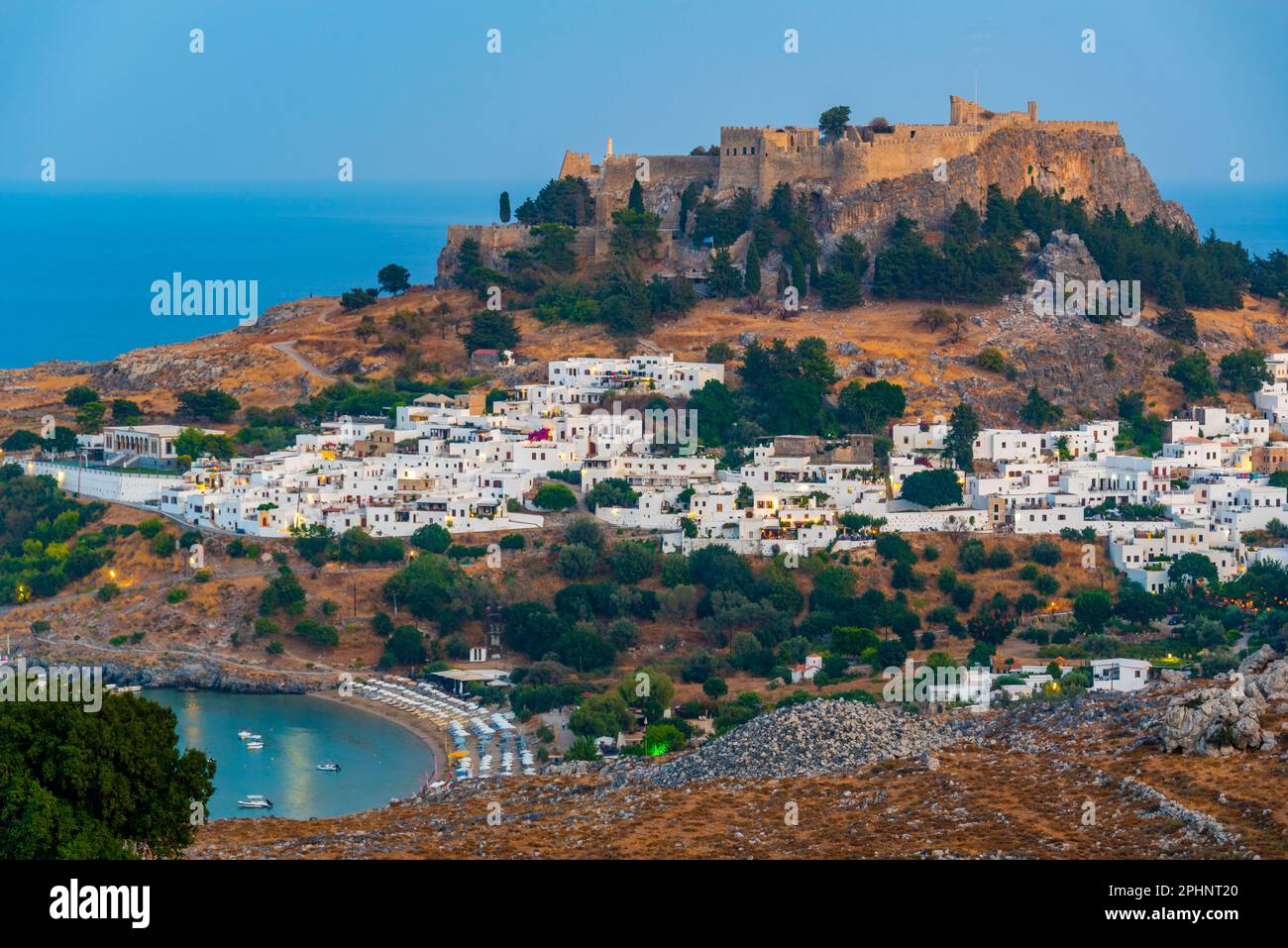 Sunset panorama of Greek town Lindos at Rhodes island Stock Photo - Alamy