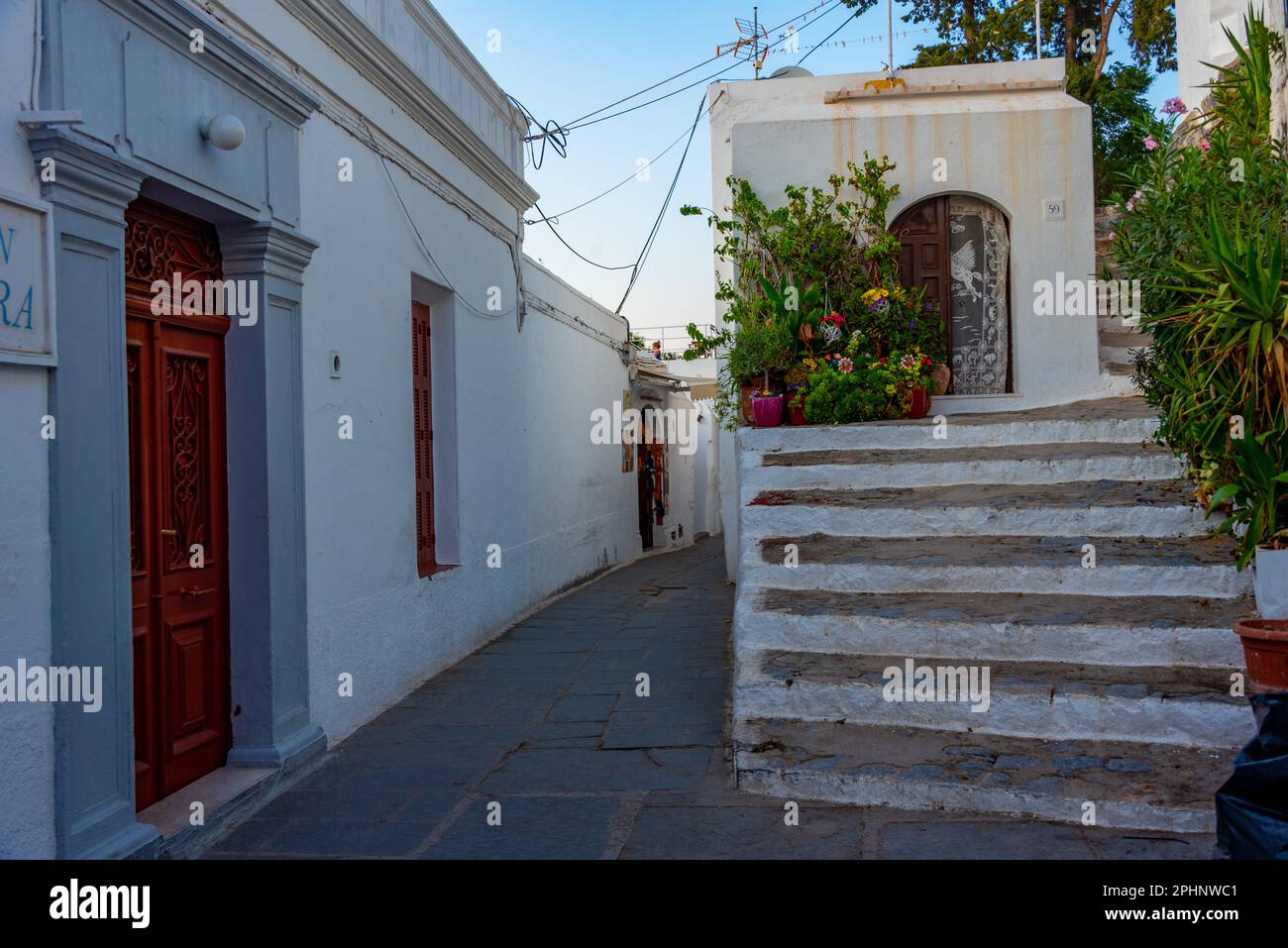 Sunset view of white streets of Greek town Lindos at Rhodes island ...