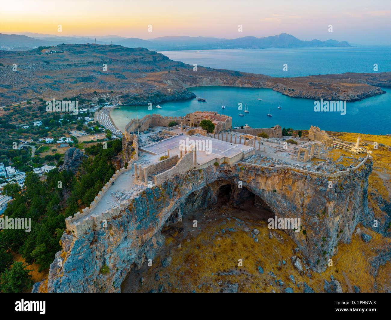 Sunset aerial view of Lindos Acropolis at Greek island Rhodes Stock ...