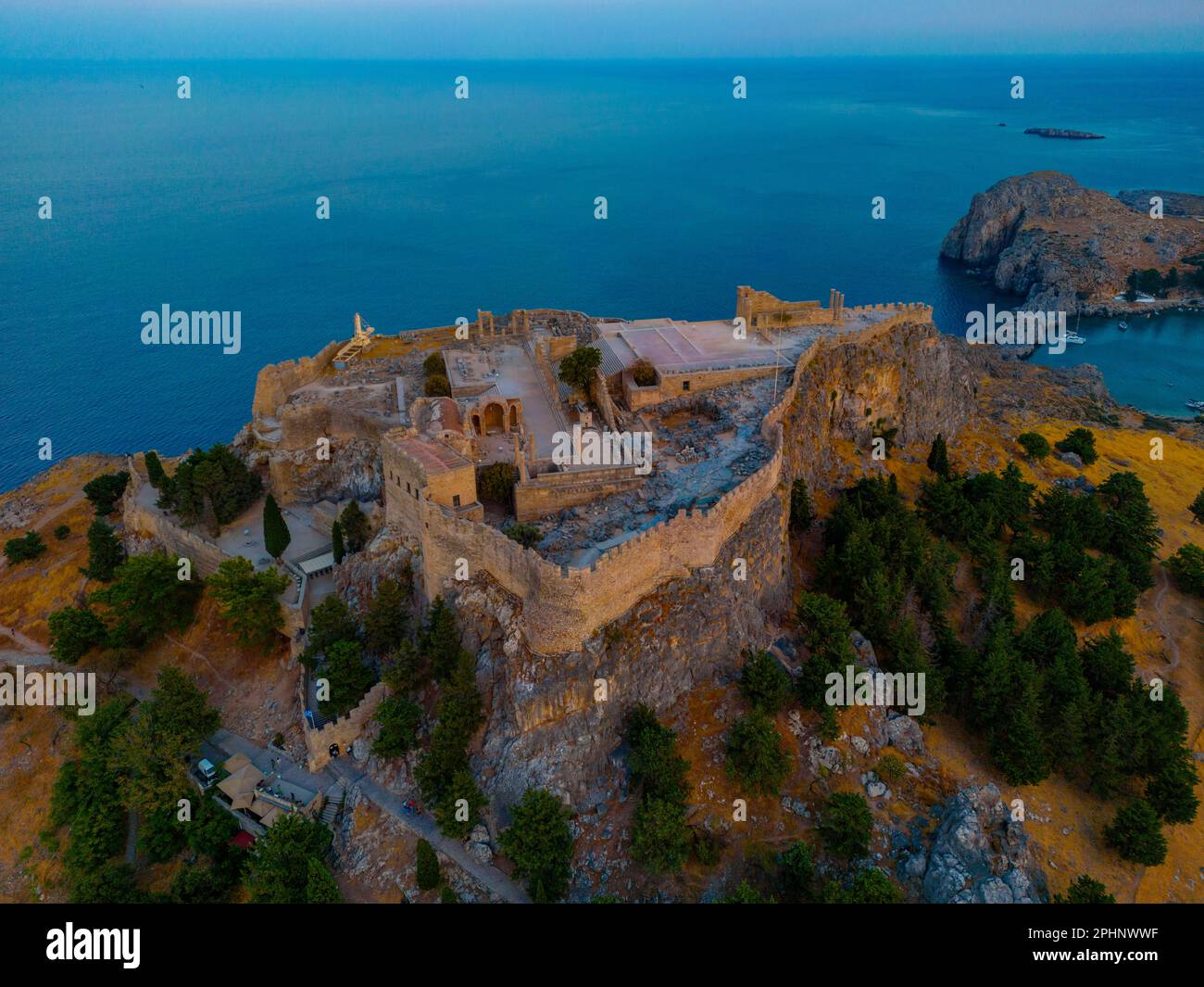 Sunset aerial view of Lindos Acropolis at Greek island Rhodes Stock ...