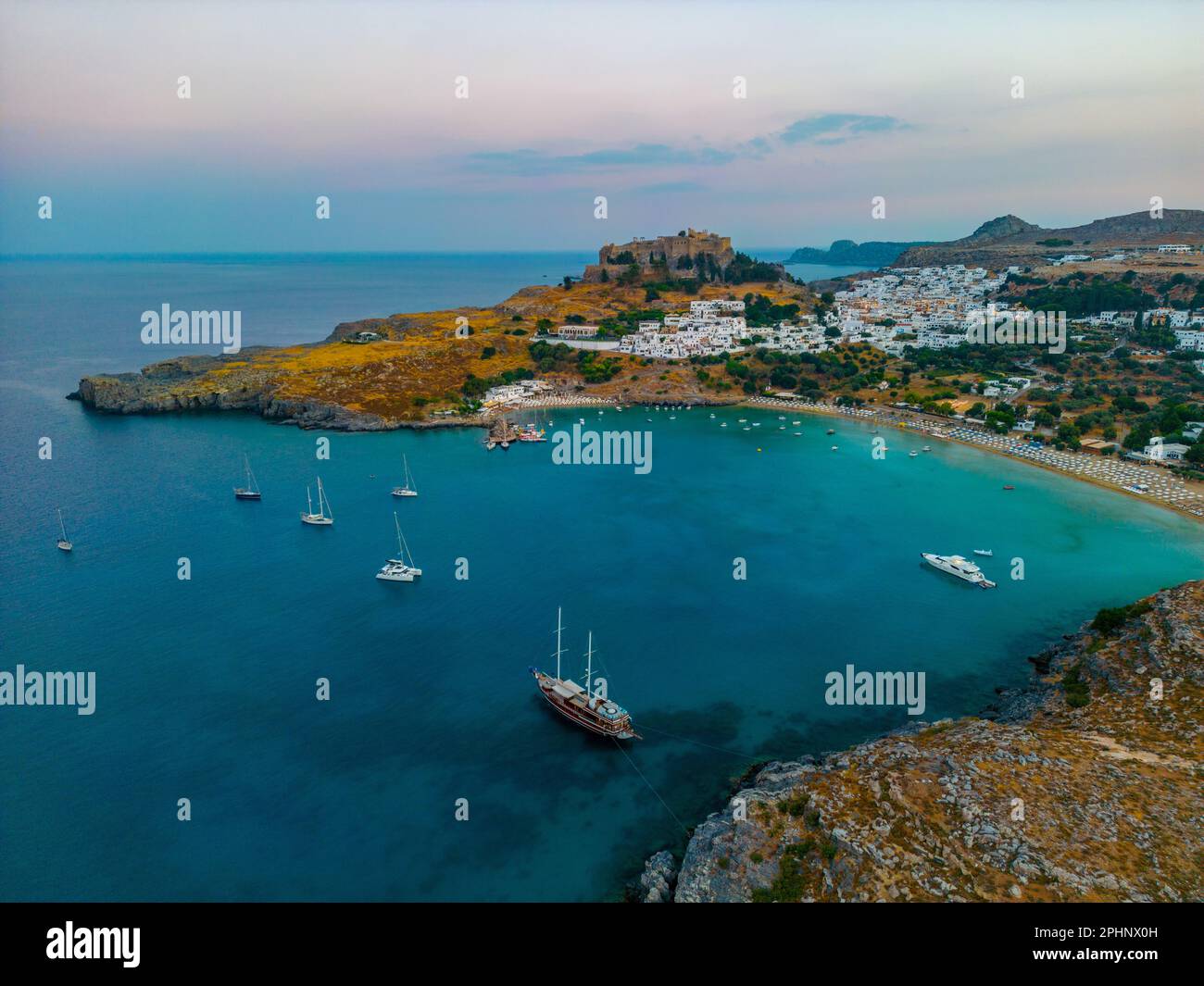 Sunset panorama of Greek town Lindos at Rhodes island Stock Photo - Alamy
