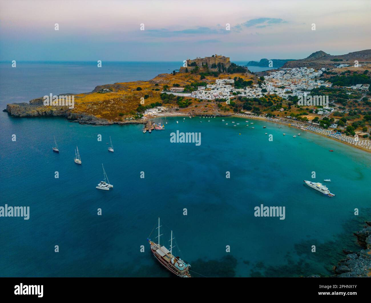 Sunset panorama of Greek town Lindos at Rhodes island Stock Photo - Alamy
