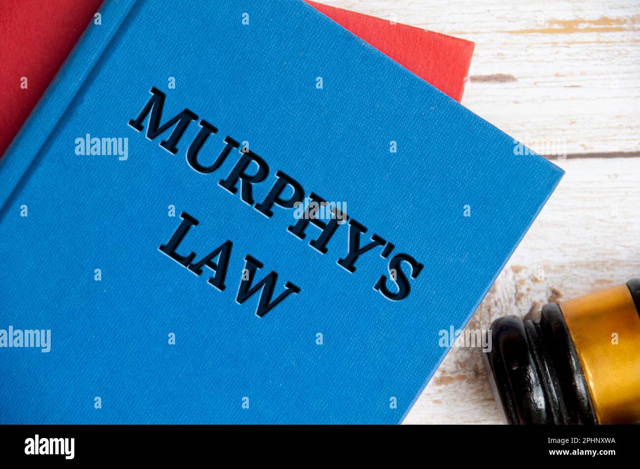 Top view of Murphy's Law book on wooden table with gavel background ...