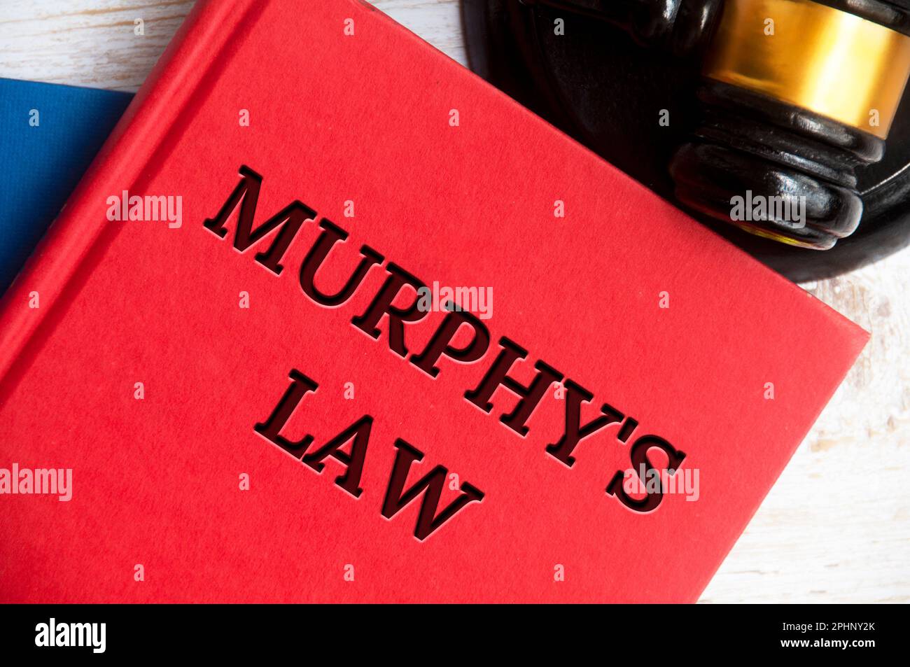 Top view of Murphy's Law book on wooden table with gavel background ...