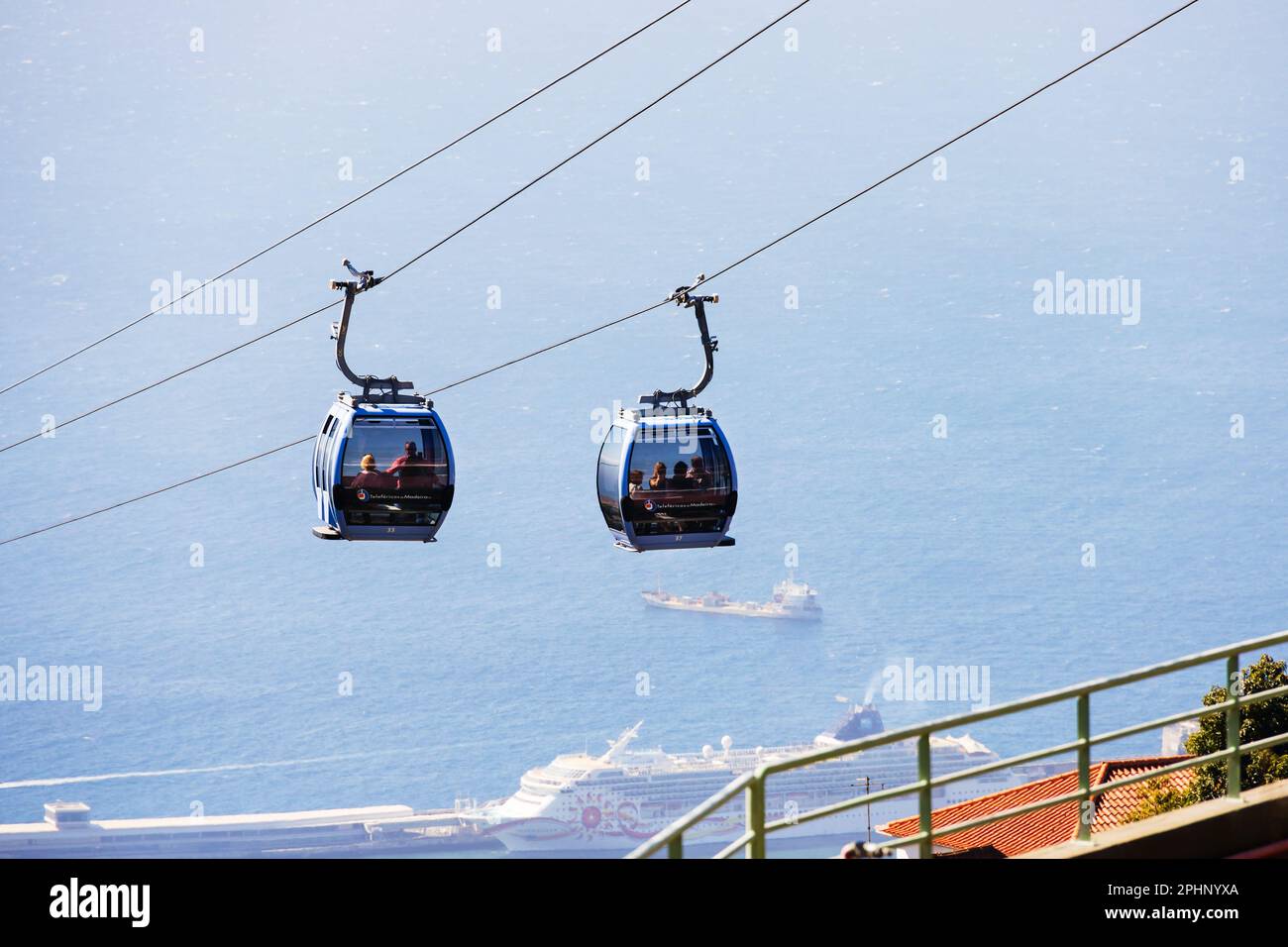 Tourist passengers ride in the Teleferico Do Funchal cable car from ...