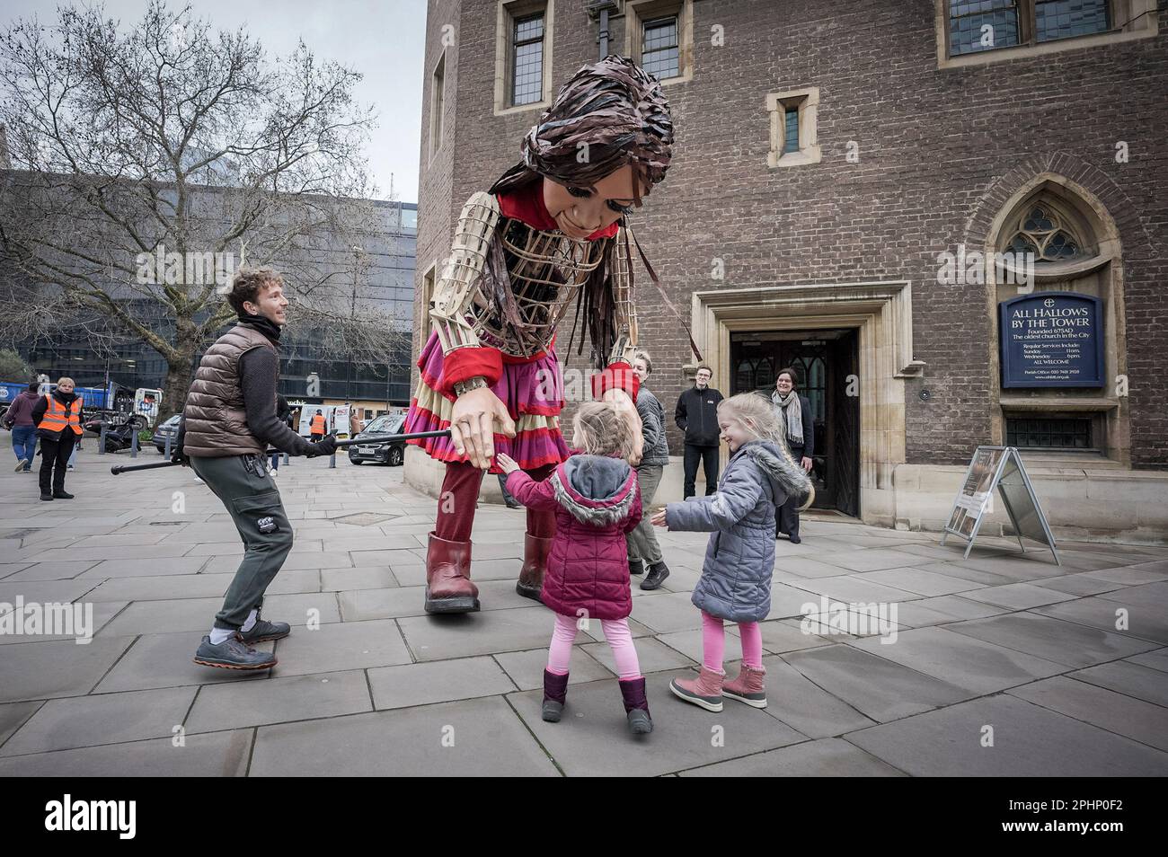 London, UK. 29th March, 2023. Little Amal arrives at Tower Hill. Amal ...