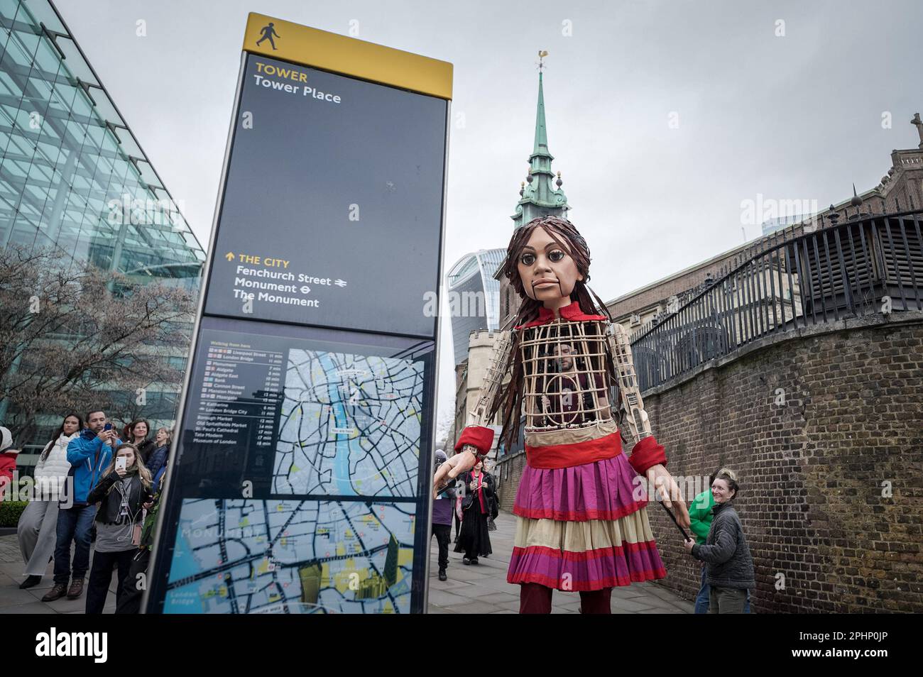 London, UK. 29th March, 2023. Little Amal arrives at Tower Hill. Amal ...