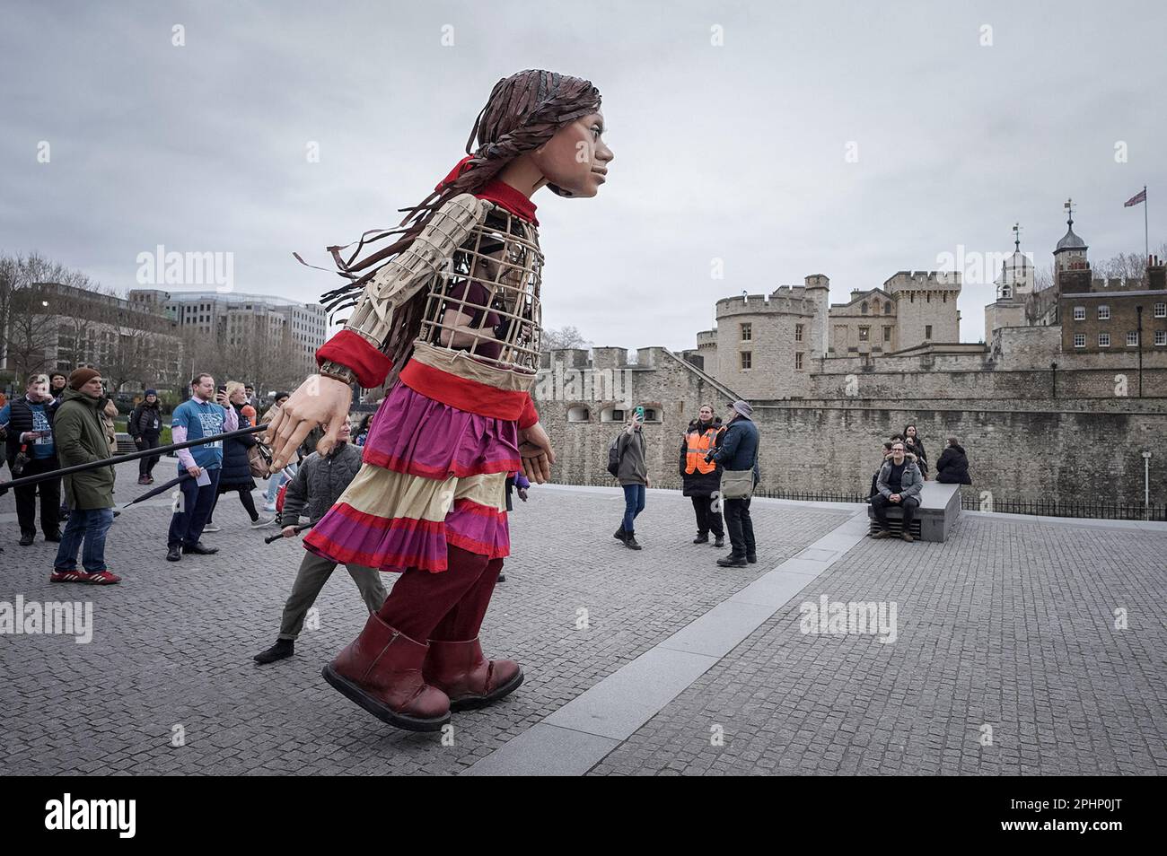 London, UK. 29th March, 2023. Little Amal arrives at Tower Hill. Amal ...