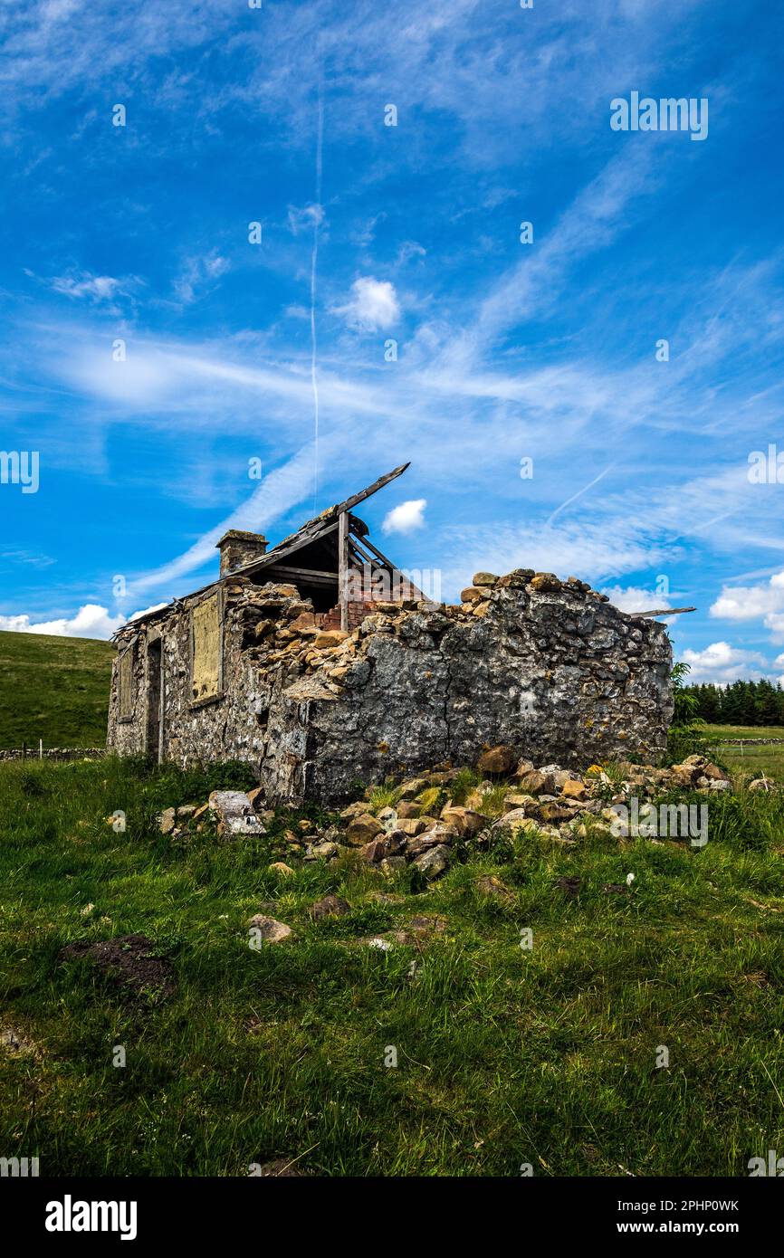 An old derelict house in remote countryside, near Ribblehead ...