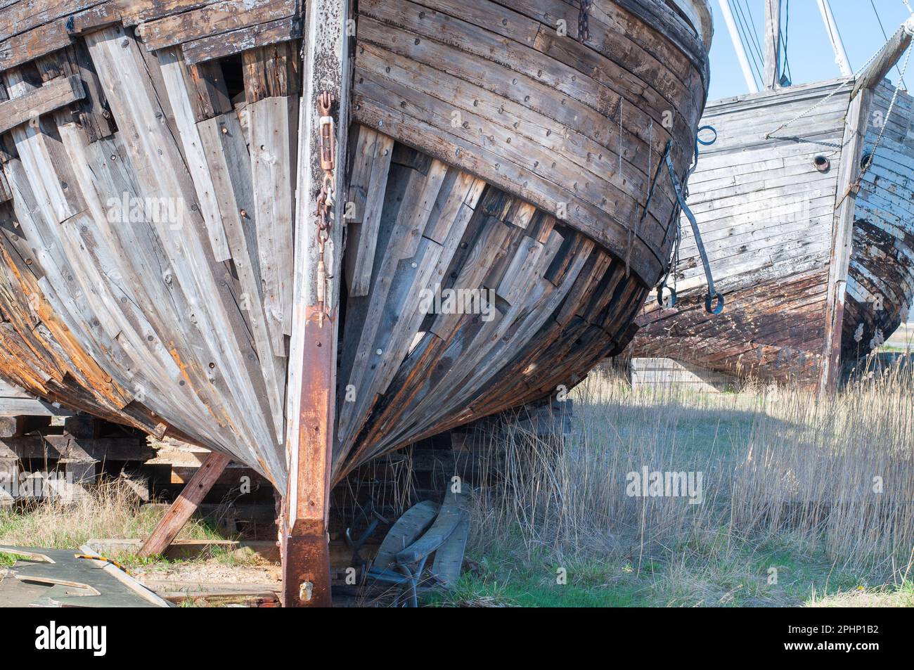 Old derelict wooden ship wreck closeup. Front side of an old abandoned ...