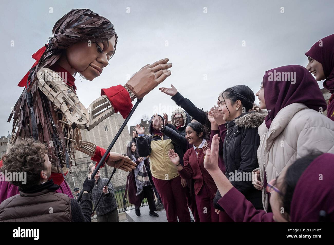 London, UK. 29th March, 2023. Little Amal arrives at Tower Hill and ...