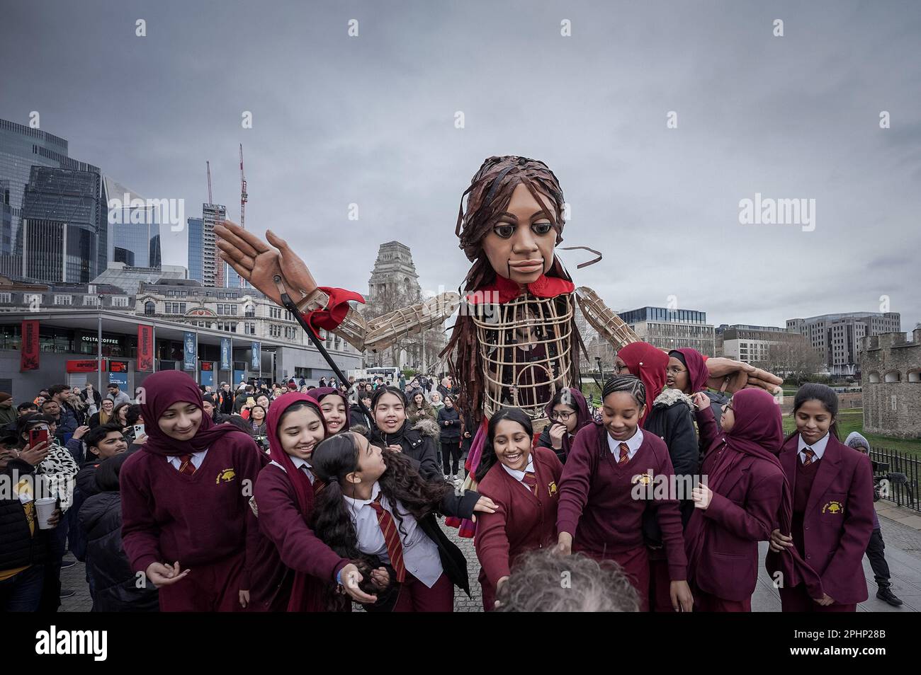 London, UK. 29th March, 2023. Little Amal arrives at Tower Hill and ...