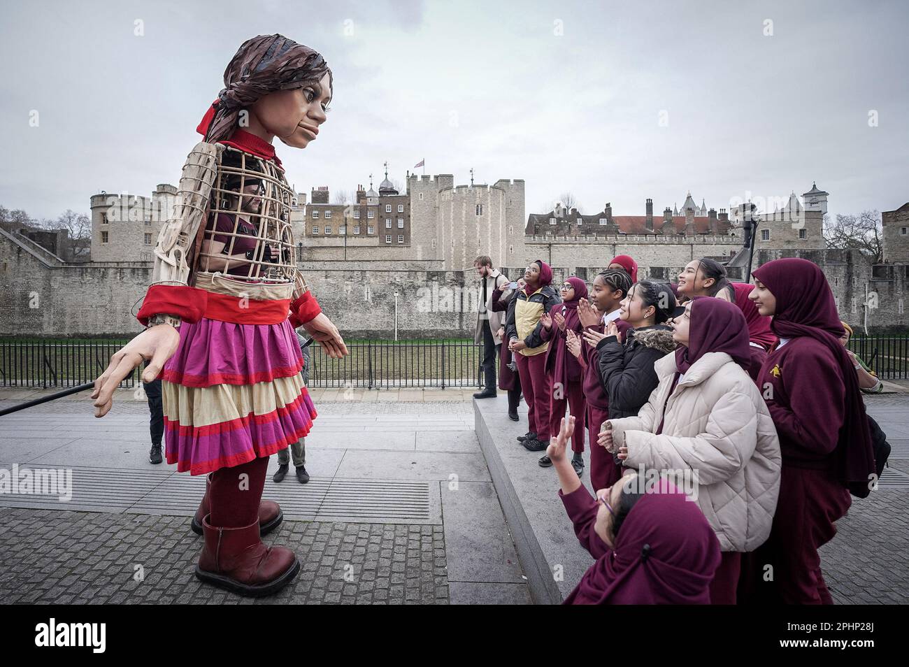 London, UK. 29th March, 2023. Little Amal arrives at Tower Hill and ...