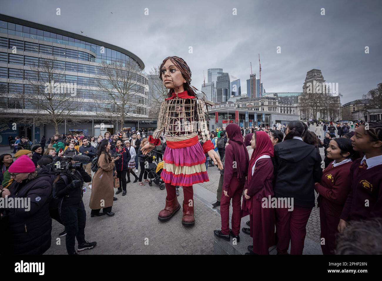 London, UK. 29th March, 2023. Little Amal arrives at Tower Hill. Amal ...