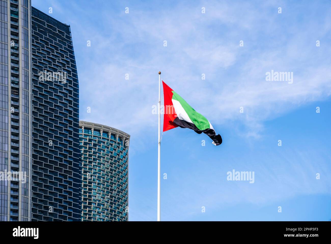 Flag of the UAE on background of the sky in Dubai. Arab Emirates ...