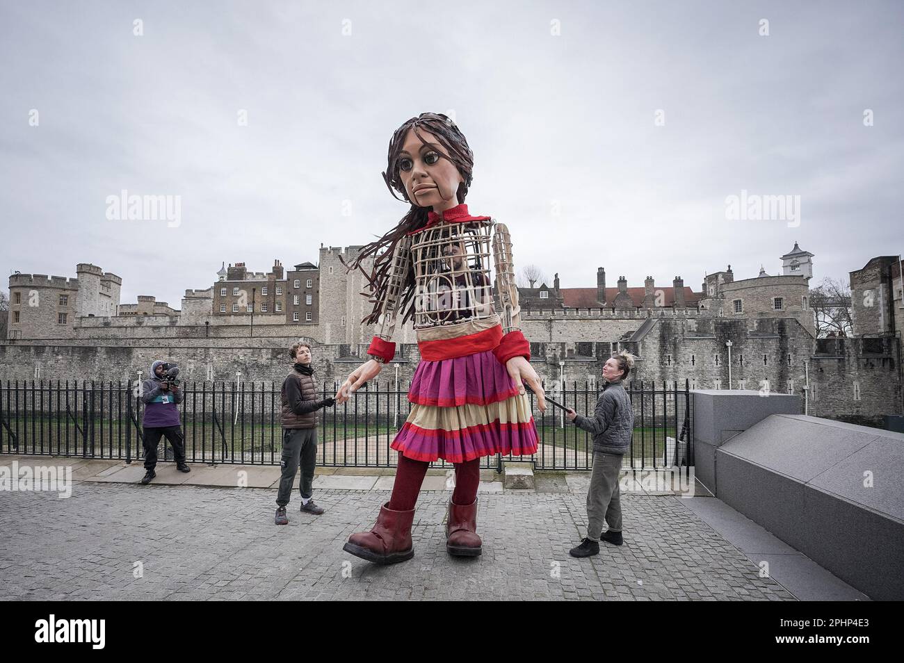 London, UK. 29th March, 2023. Little Amal arrives at Tower Hill. Amal ...