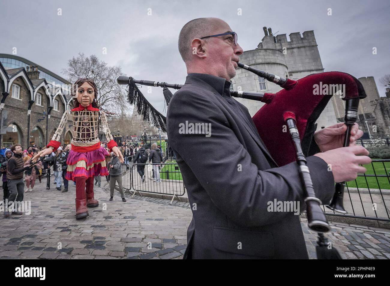 London, UK. 29th March, 2023. Little Amal arrives at Tower Hill. Amal ...