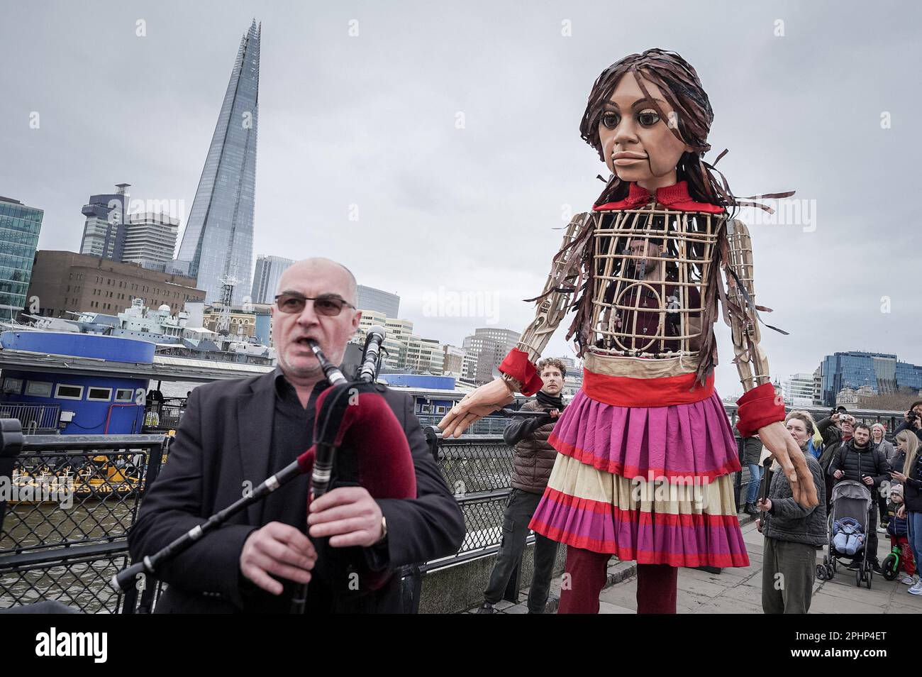 London, UK. 29th March, 2023. Little Amal arrives at Tower Hill. Amal ...