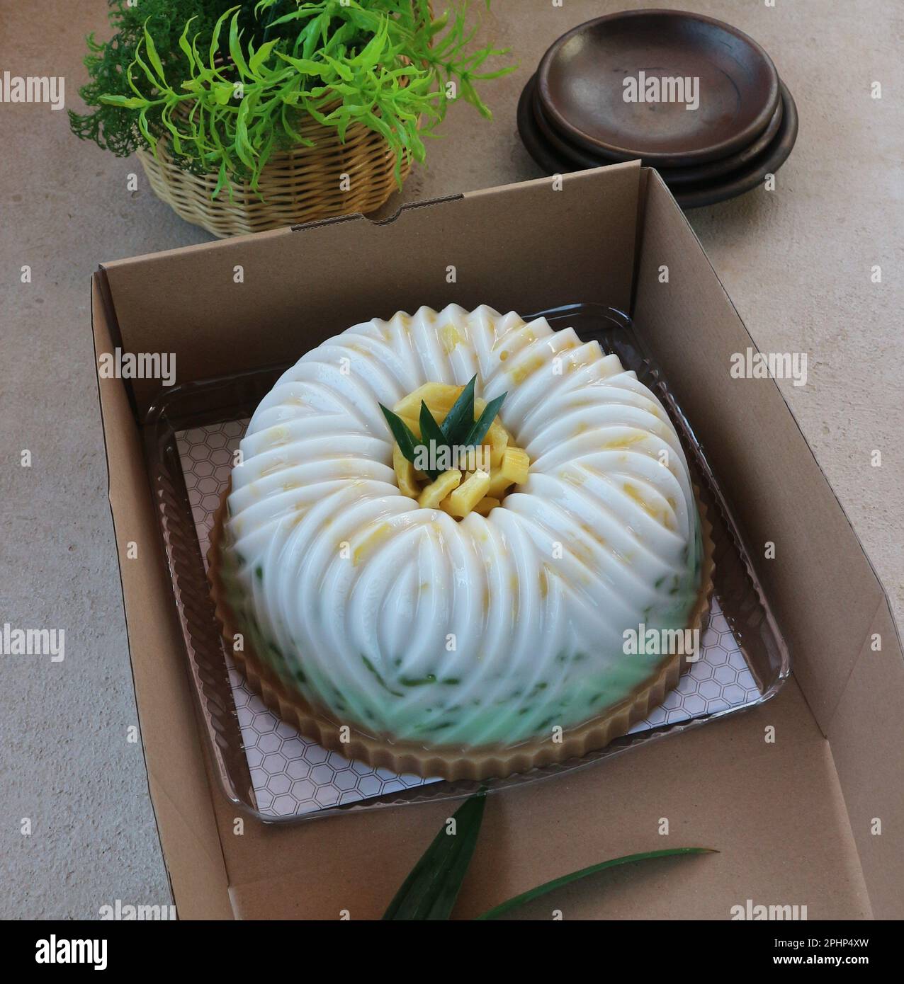 Pudding filled with pieces of jackfruit in cardboard packaging Stock ...