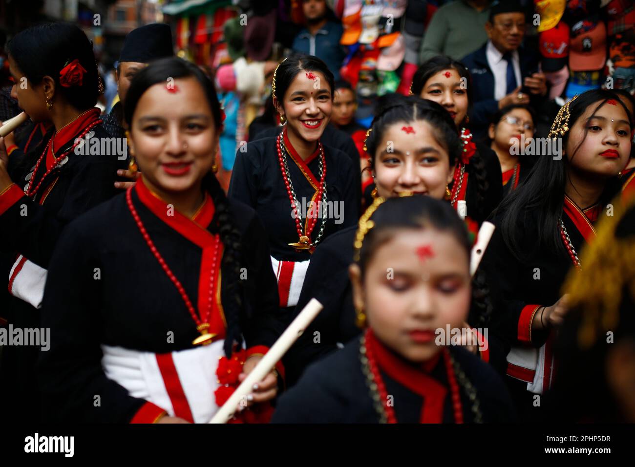 Kathmandu, Nepal. 29th Mar, 2023. Young girls donned in traditional ...