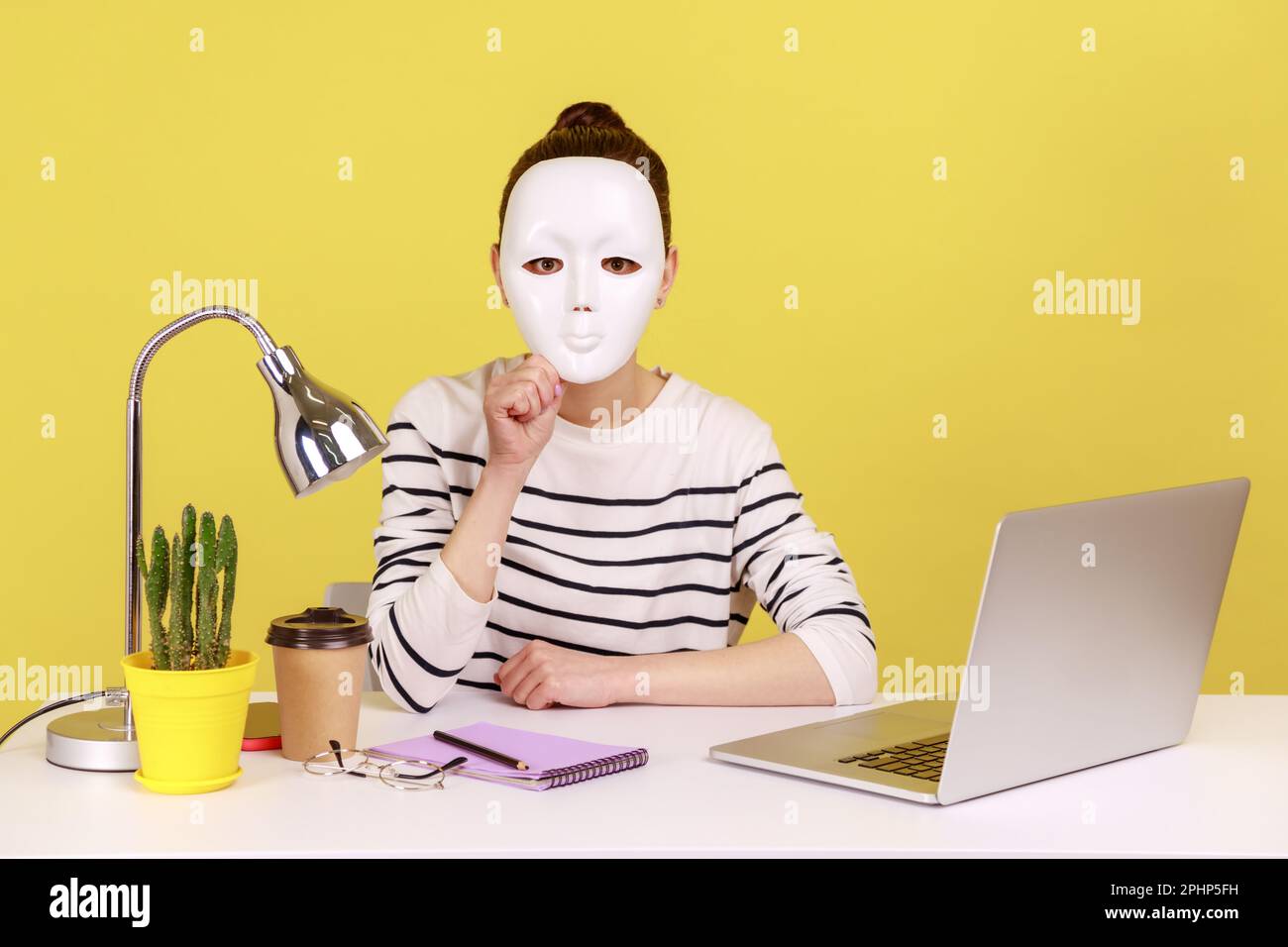Portrait of unknown anonymous woman covering her face with white mask ...