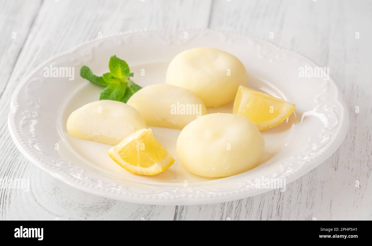 Lemon mochi - Japanese rice cake on the serving plate Stock Photo - Alamy