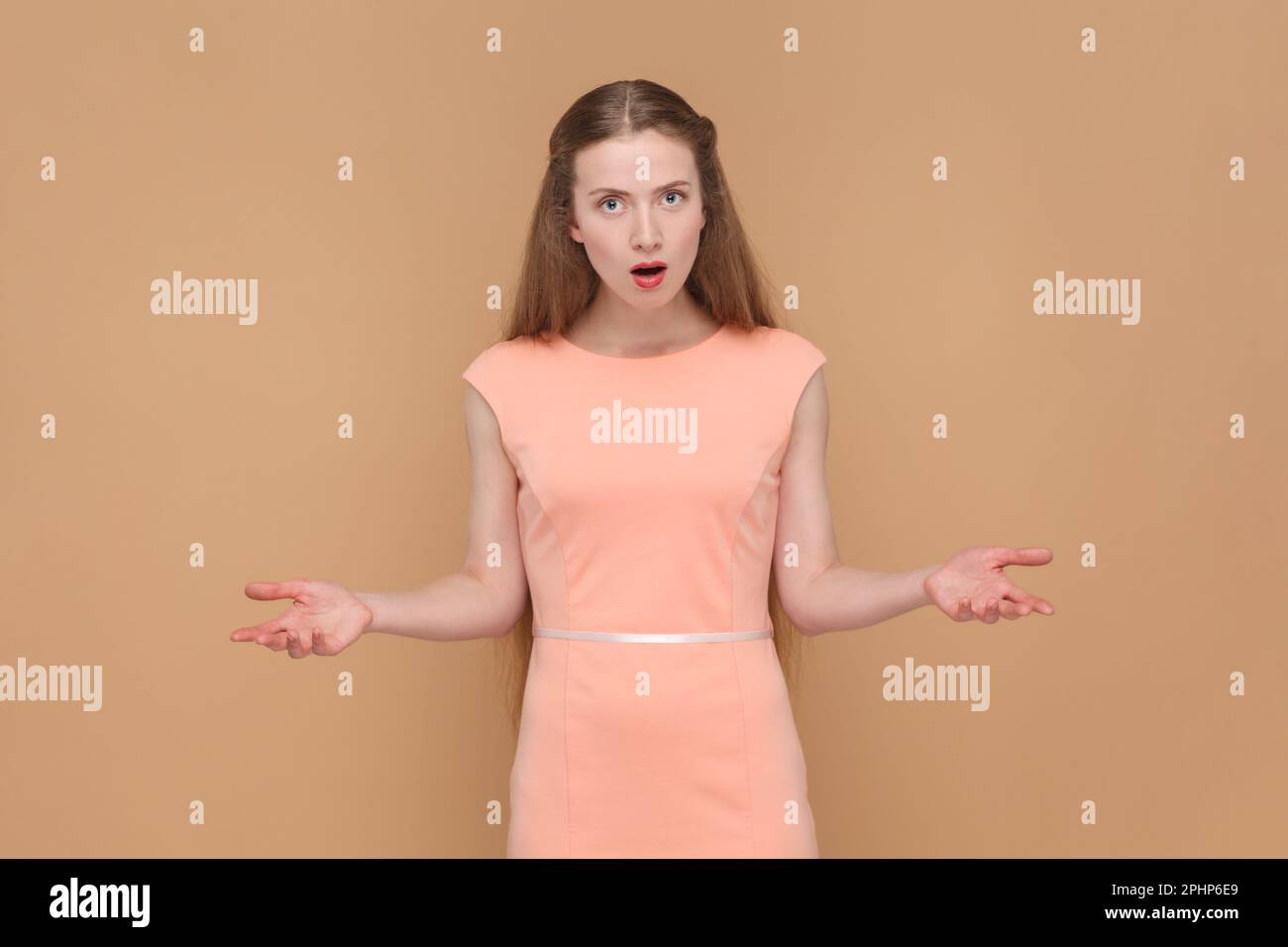 Portrait of angry shocked upset woman with long hair standing with ...