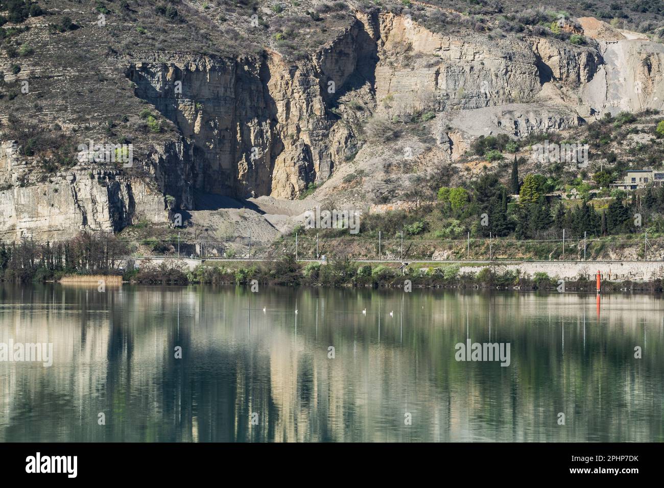 A mine extracting limestone rocks for cement, a mine reflecting in the ...