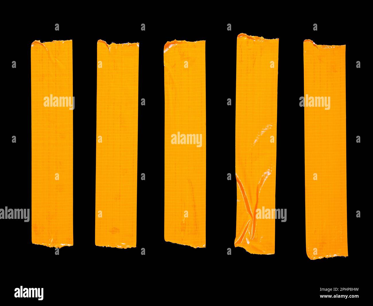 5 vertical pieces of orange adhesive tape isolated on a black ...