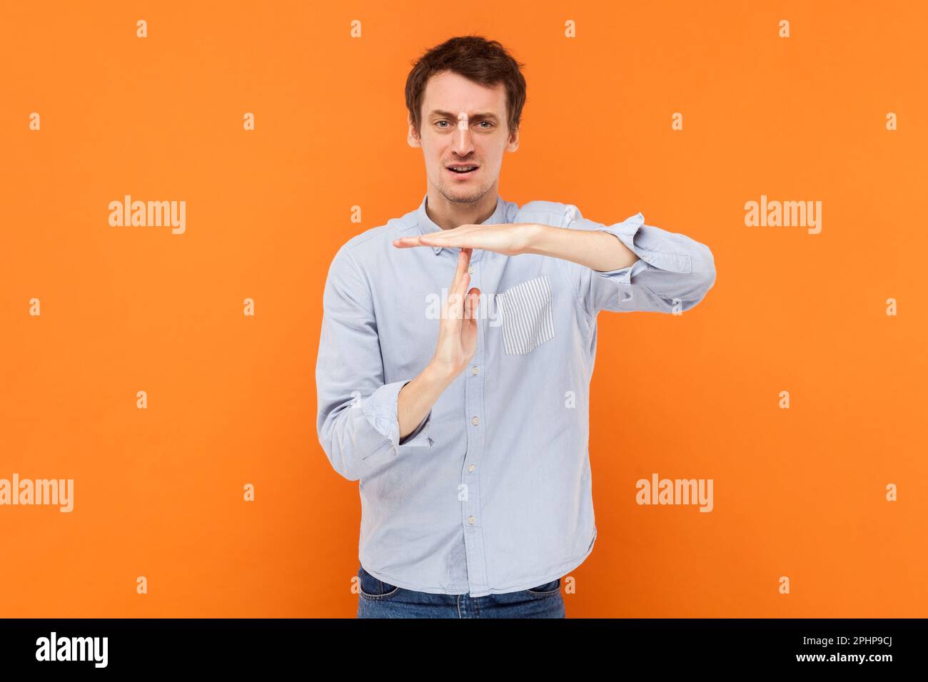 Man making timeout gesture hands hi-res stock photography and images ...