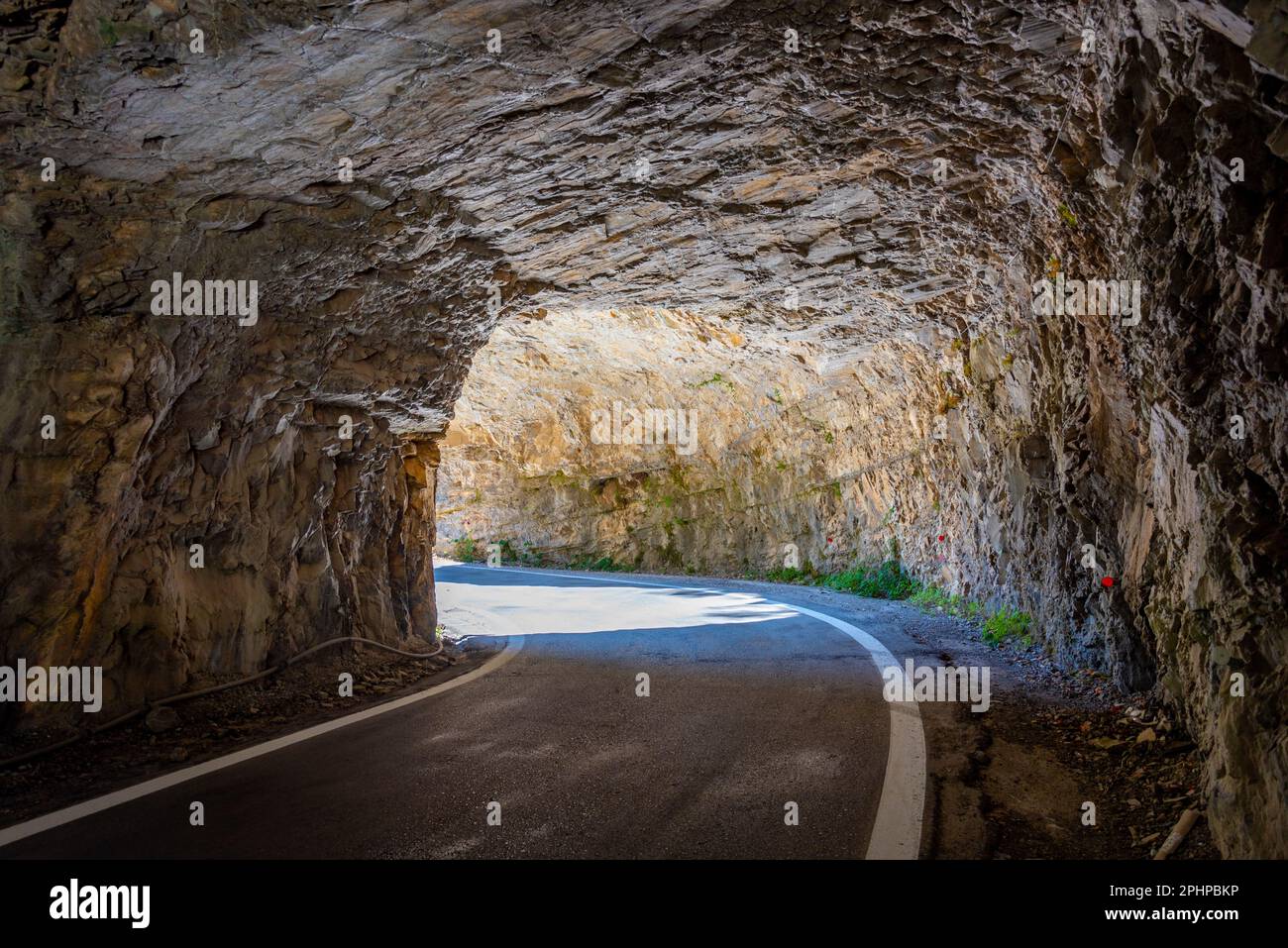 Tunnel at a road passing through Langada pass in Greece Stock Photo - Alamy