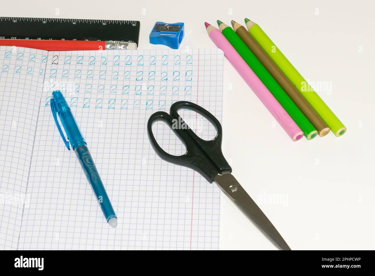 ViewView of a notebook with written numbers, next to it are a pen, a ...