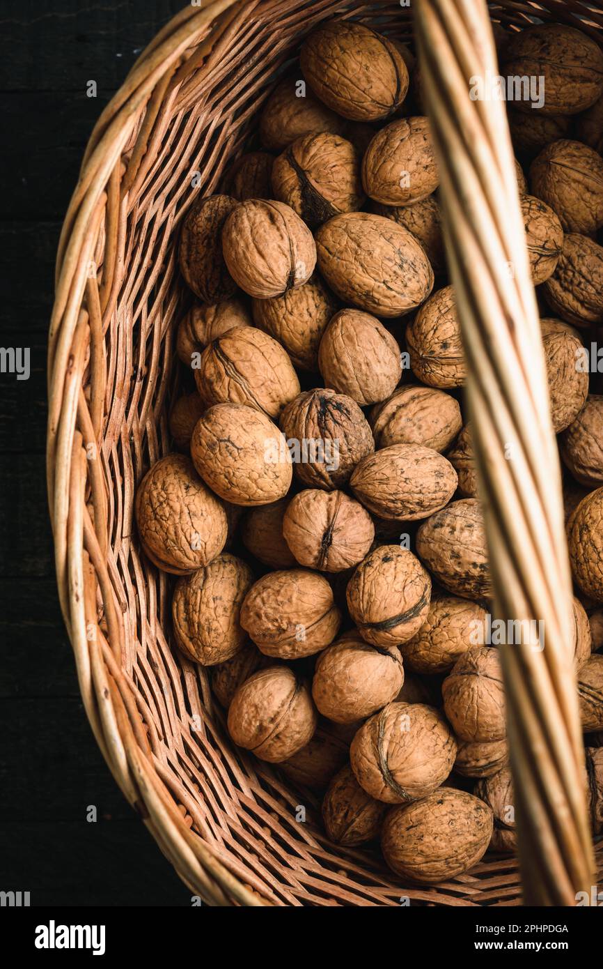 Harvest of walnuts in a basket, top view Stock Photo - Alamy