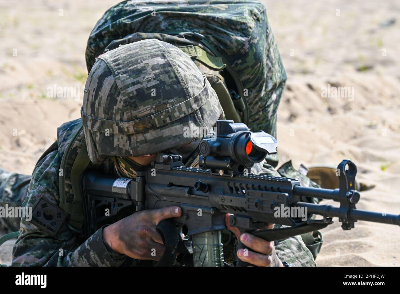 Pohang, South Korea. 29th Mar, 2023. A South Korean marine aims a ...