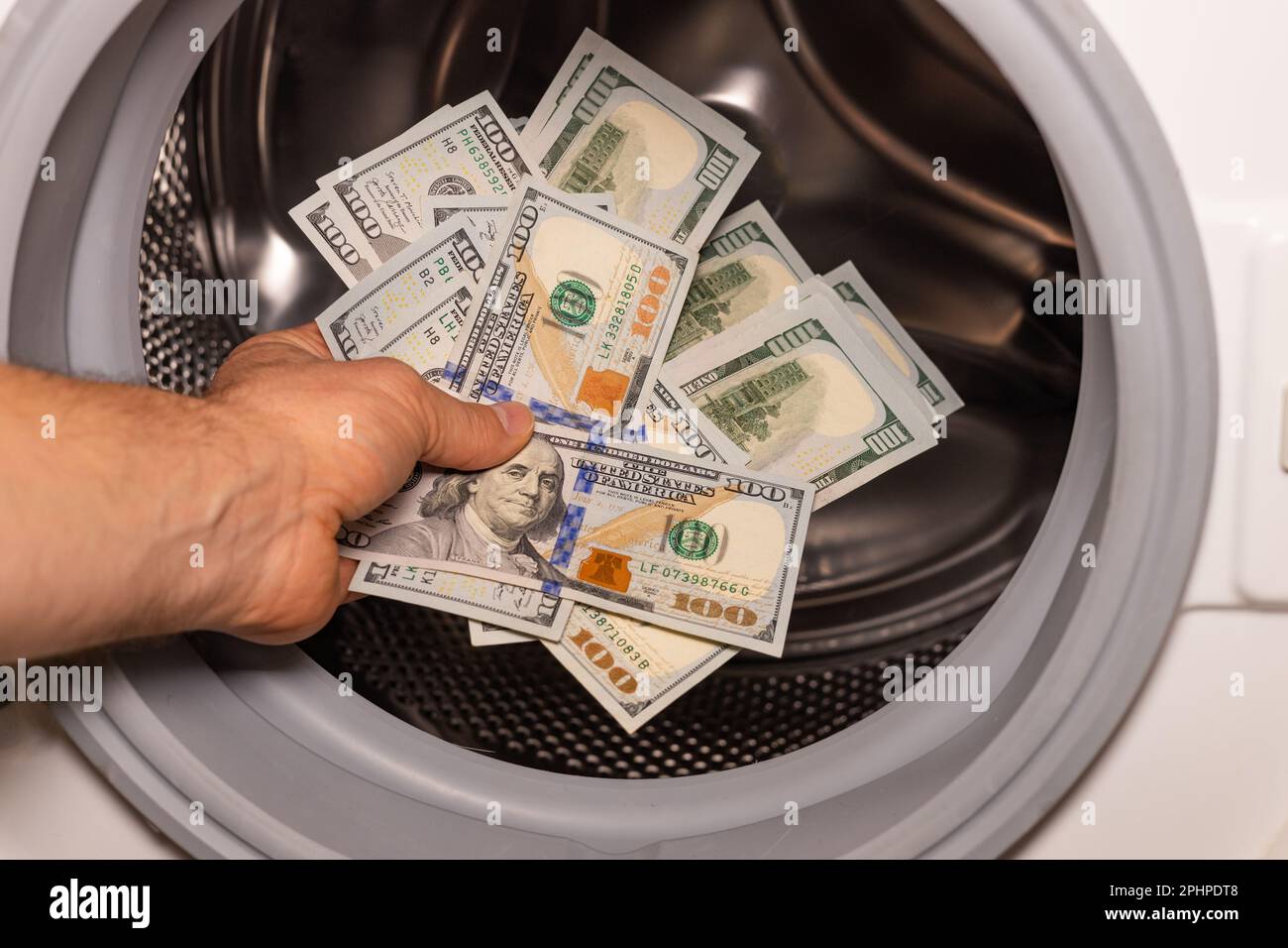 American dollars being put into the washing machine, Concept, Money ...