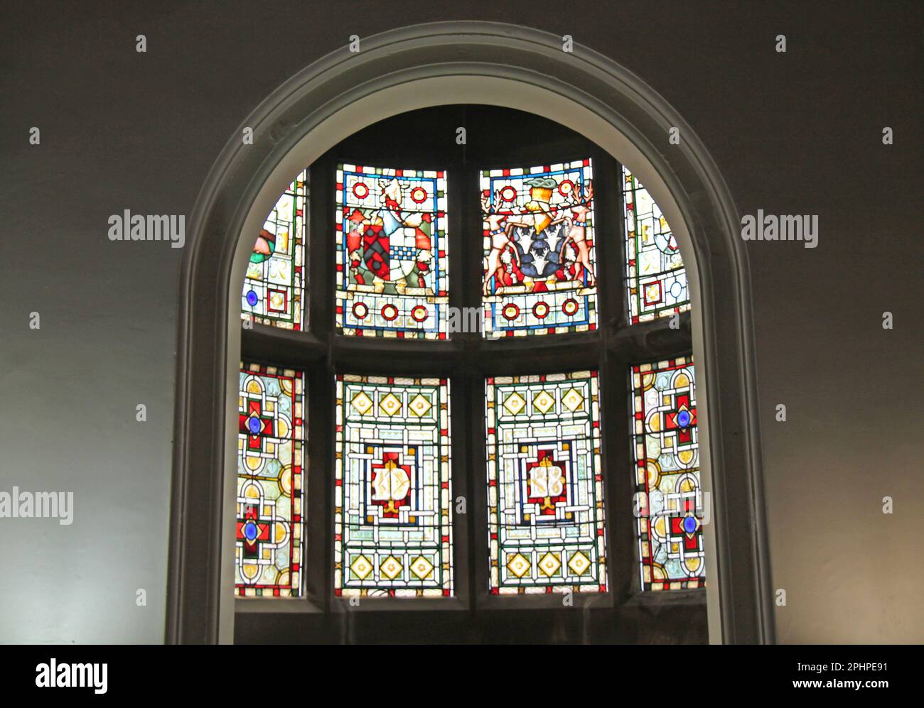 Colourful Display of Stained Glass in an Arched Window Stock Photo - Alamy