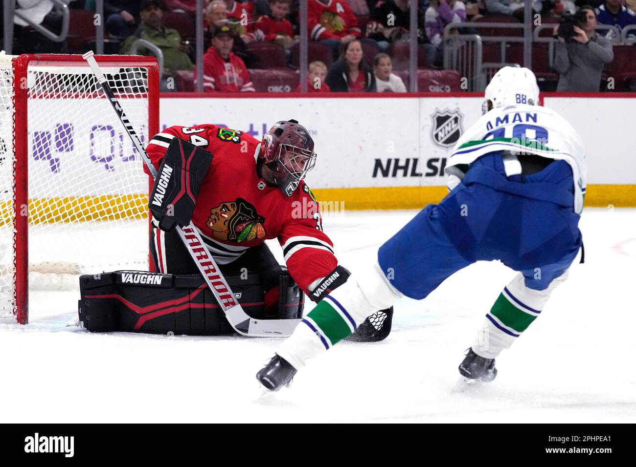 Chicago Blackhawks goaltender Petr Mrazek, left, saves a shot by ...
