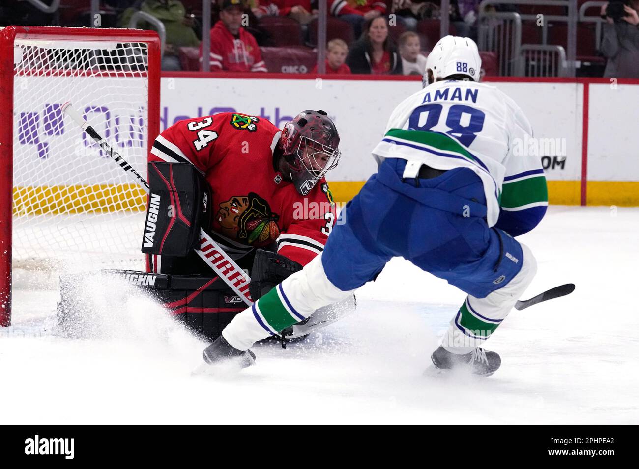 Chicago Blackhawks goaltender Petr Mrazek, left, saves a shot by ...