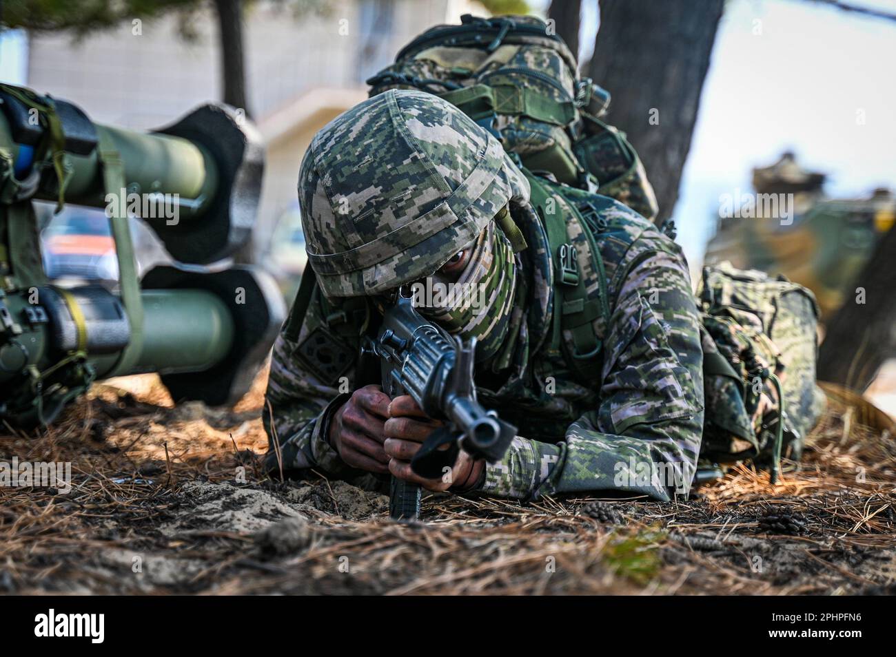 Pohang, South Korea. 29th Mar, 2023. A South Korean marine aims a ...
