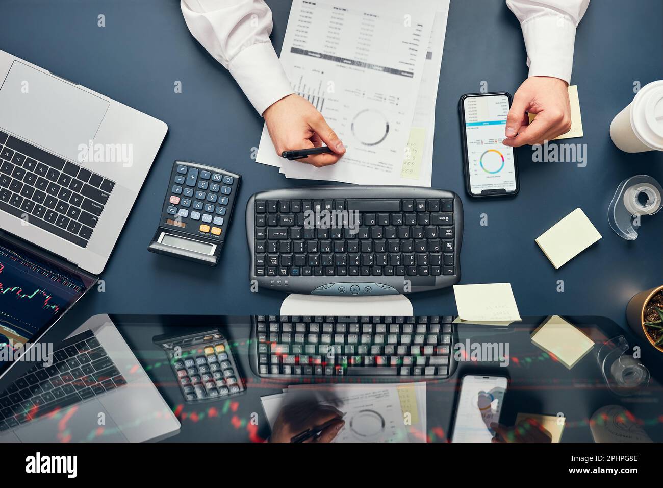 Businessman trading stocks online. Stock investor analysing numbers at ...