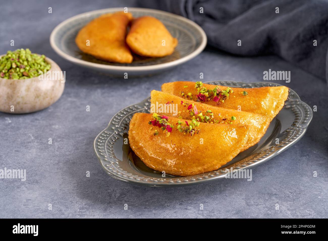 Arabian pancake Qatayef with cheese and pistachio . Traditional ramadan ...